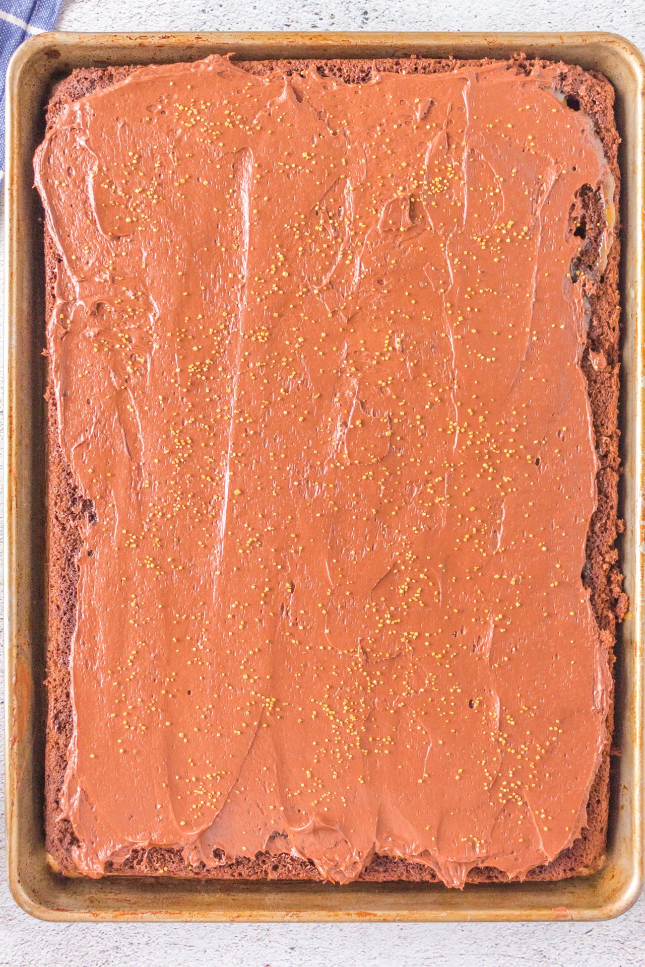 Moist Chocolate sheet pan poke cake - The Kitchen Bucket List