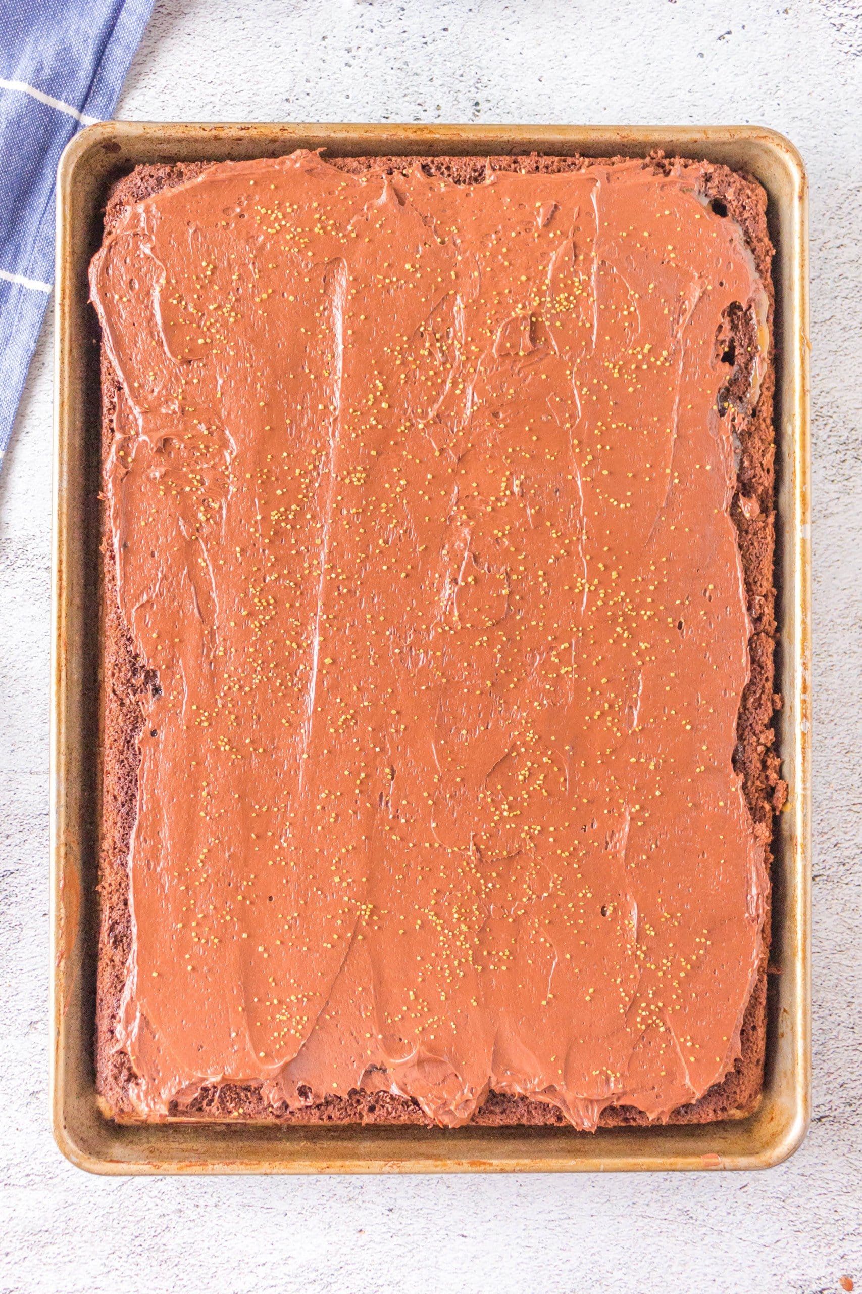 Moist Chocolate sheet pan poke cake - The Kitchen Bucket List